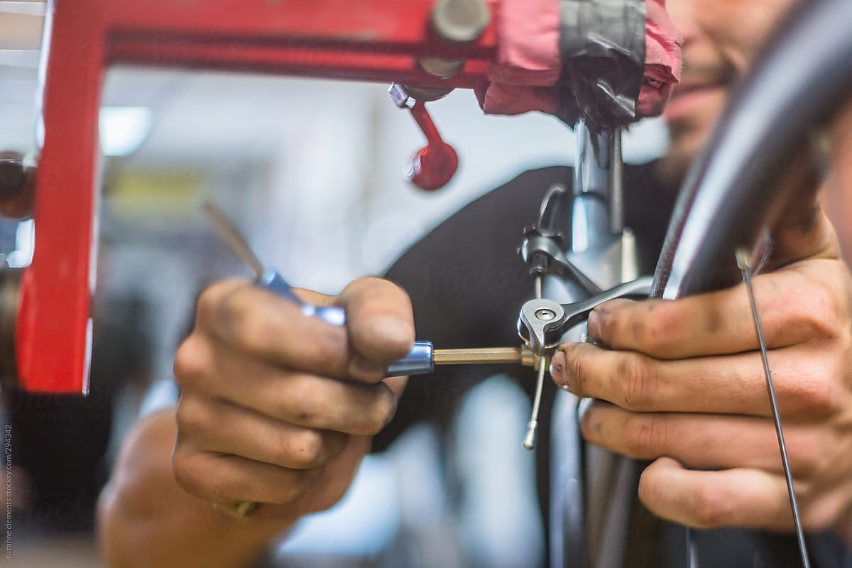 "Bicycle Mechanic Working On A Mountain Bike" by Stocksy Contributor ...