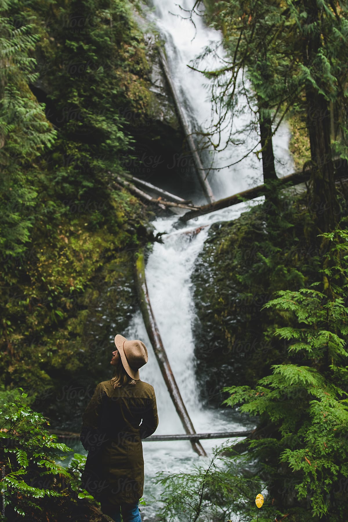 "Woman And Waterfall" by Stocksy Contributor "Tari Gunstone" - Stocksy