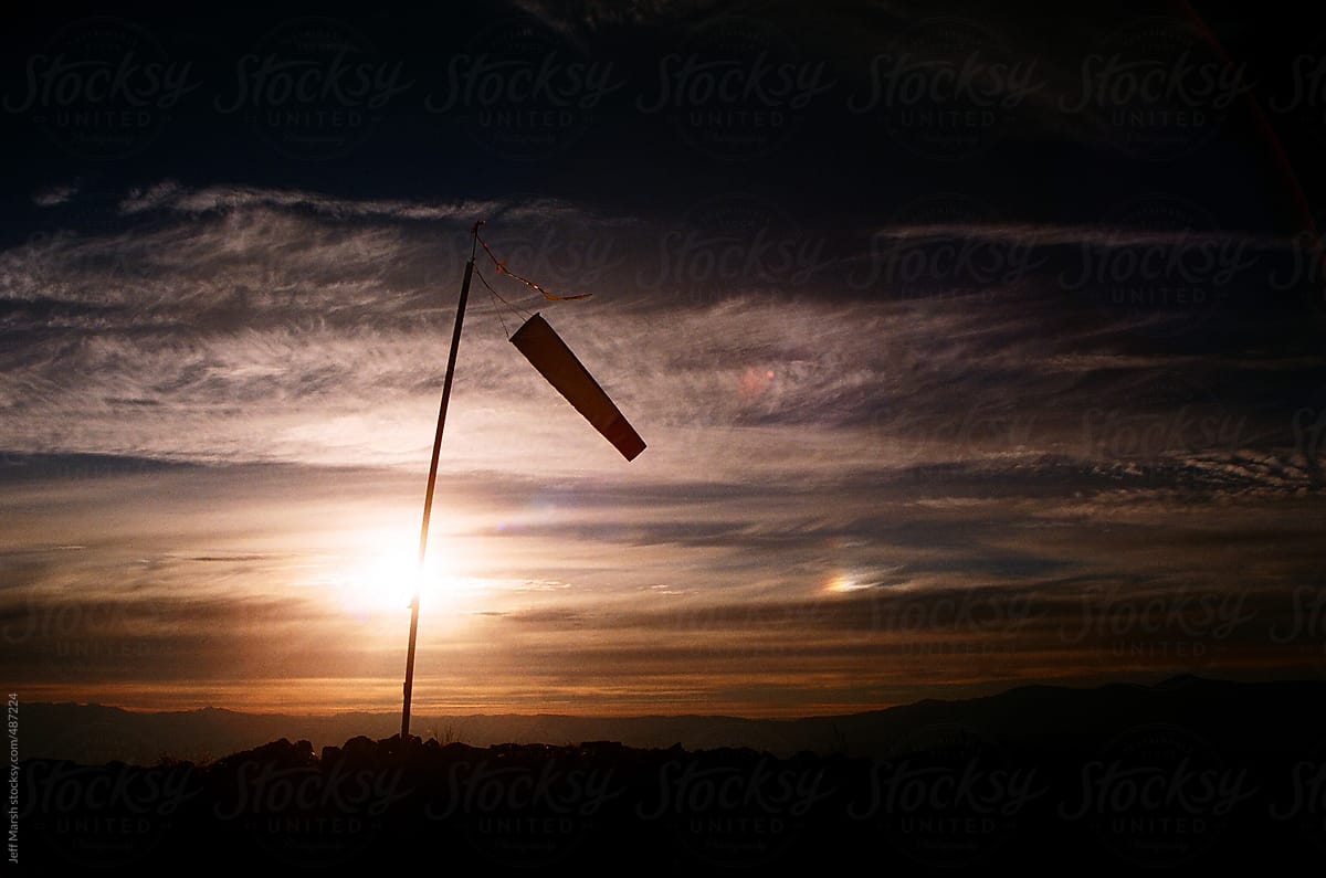 "Wind Sock In Sunset" by Stocksy Contributor "Jeff Marsh" - Stocksy
