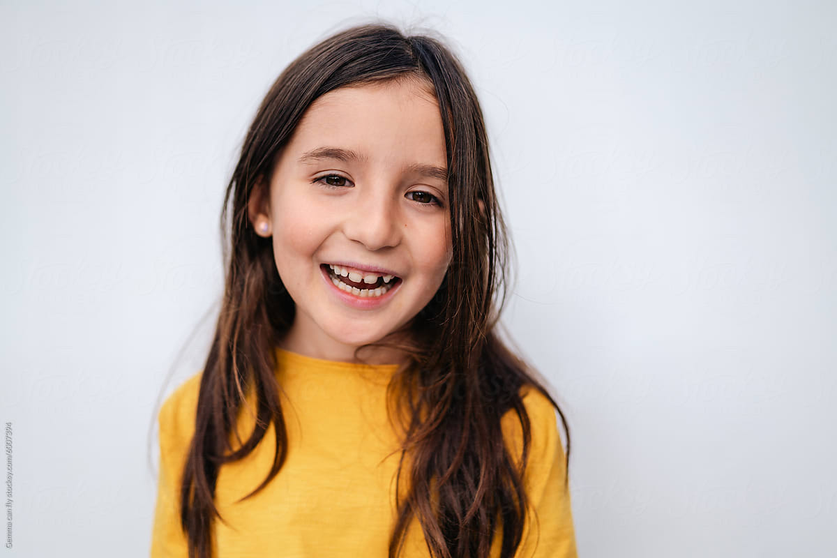 "Smiling Tween Girl In Yellow Top Headshot" by Stocksy Contributor ...