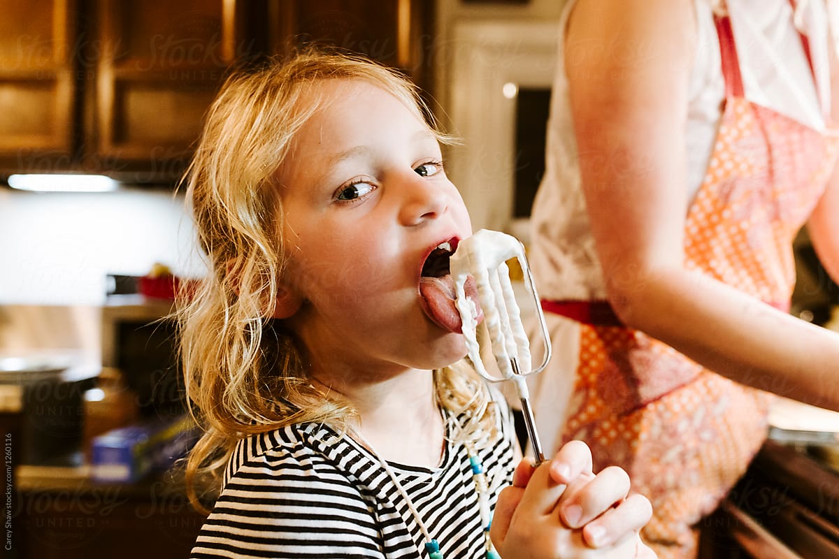 "Girl Licking Food Off Mixing Utensil" by Stocksy Contributor "Carey ...