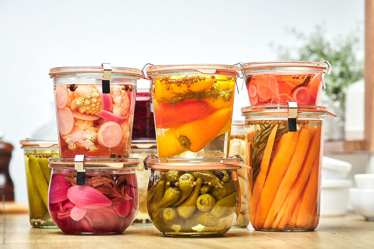 pickled-vegetables-on-a-kitchen-table-del-colaborador-de-stocksy-mart-sans-stocksy
