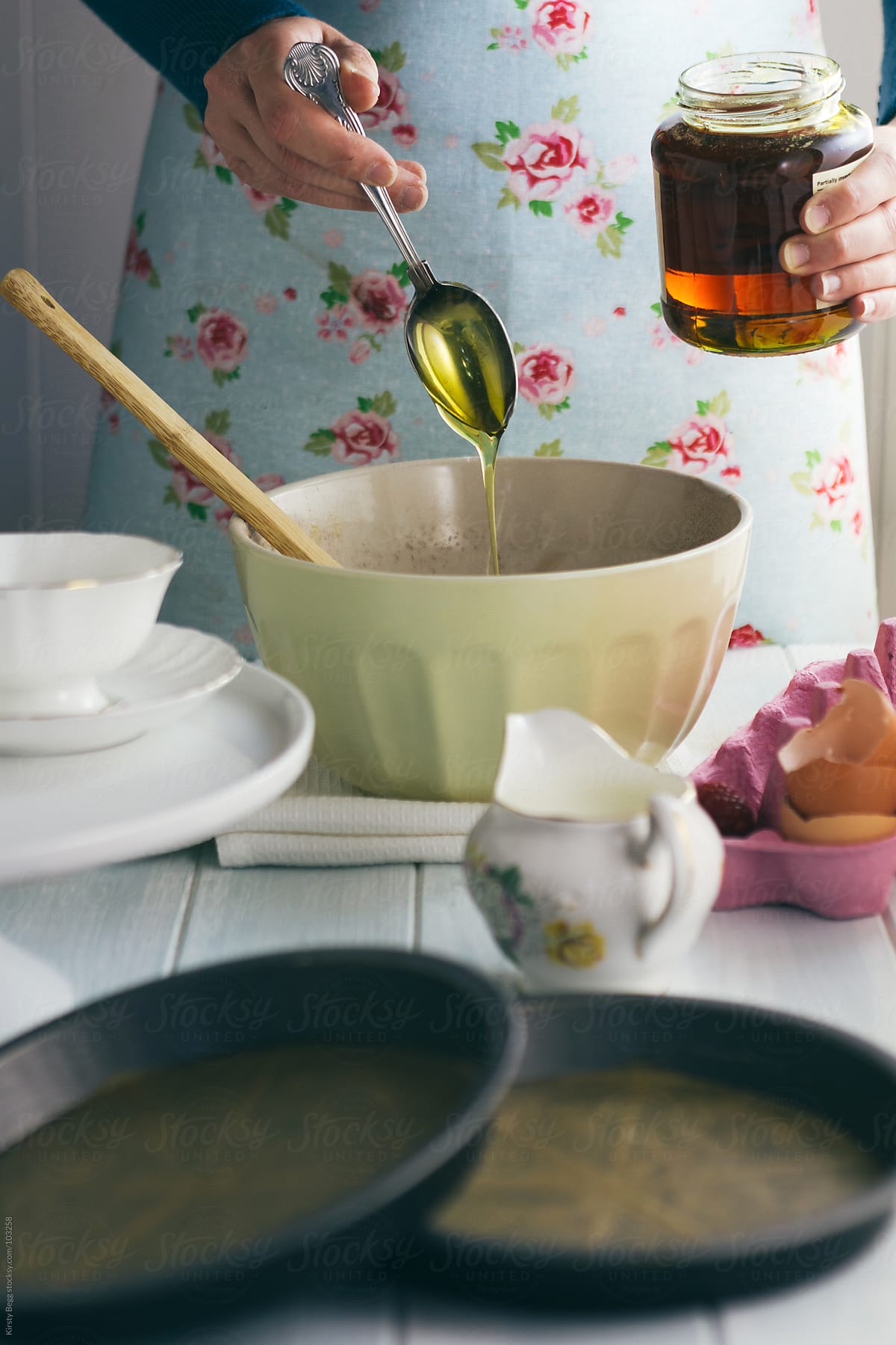 "Woman Adding Golden Syrup Into Mixing Bowl To Make Chocolate Cak" by ...