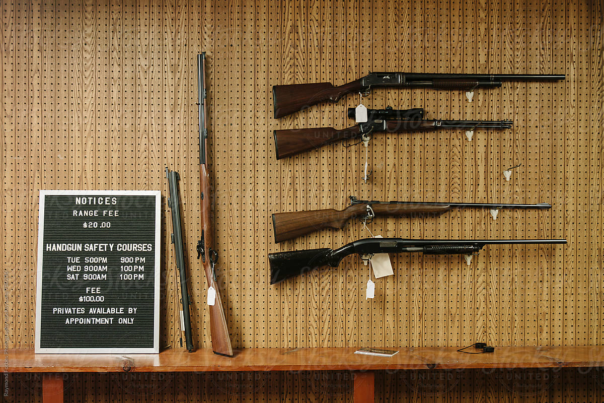 "Rack O' Guns" by Stocksy Contributor "Raymond Forbes LLC" - Stocksy