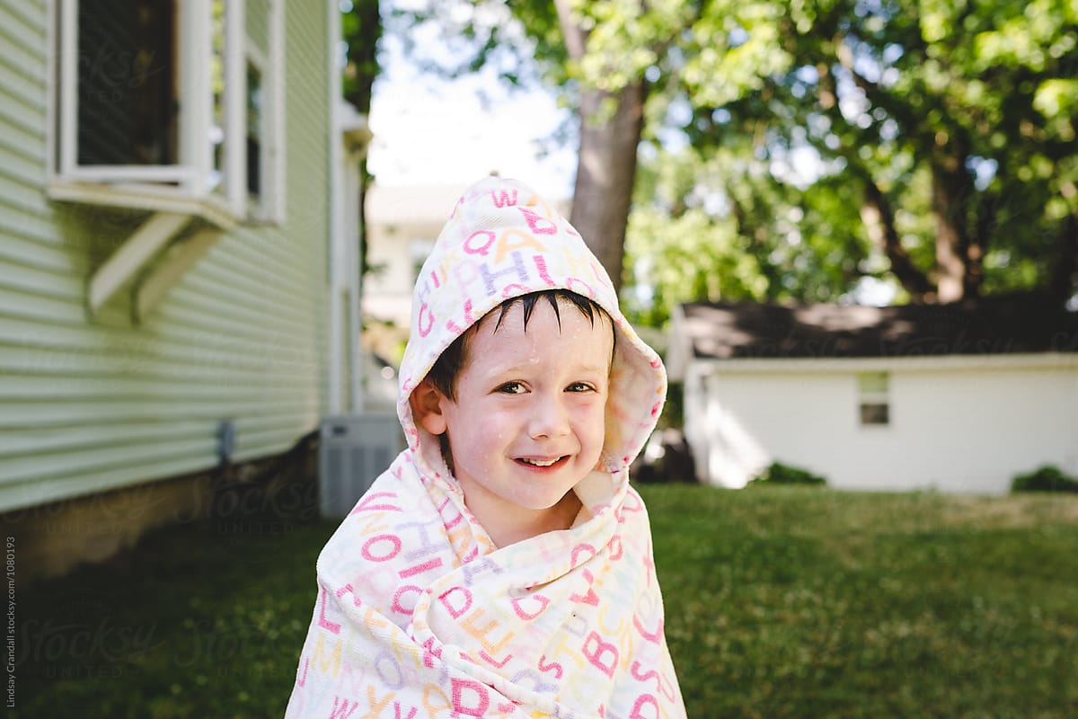 "Smiling Child Wrapped In Towel After Swimming" by Stocksy Contributor ...