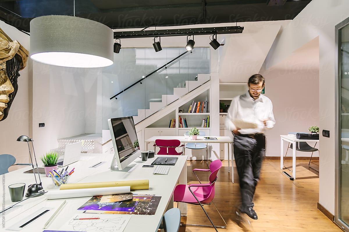 "Man Working In A Modern Trendy Office" by Stocksy Contributor "VICTOR ...
