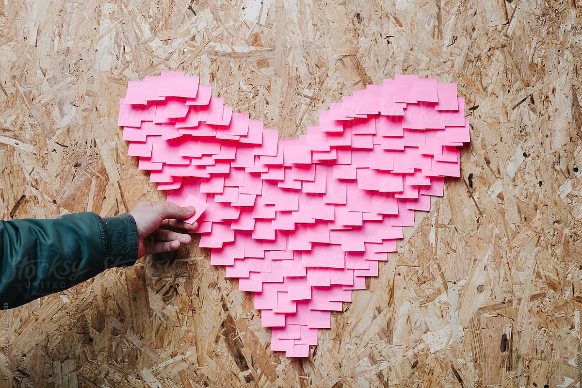 "Person Making Heart Of Stickers" by Stocksy Contributor "Javier Díez ...