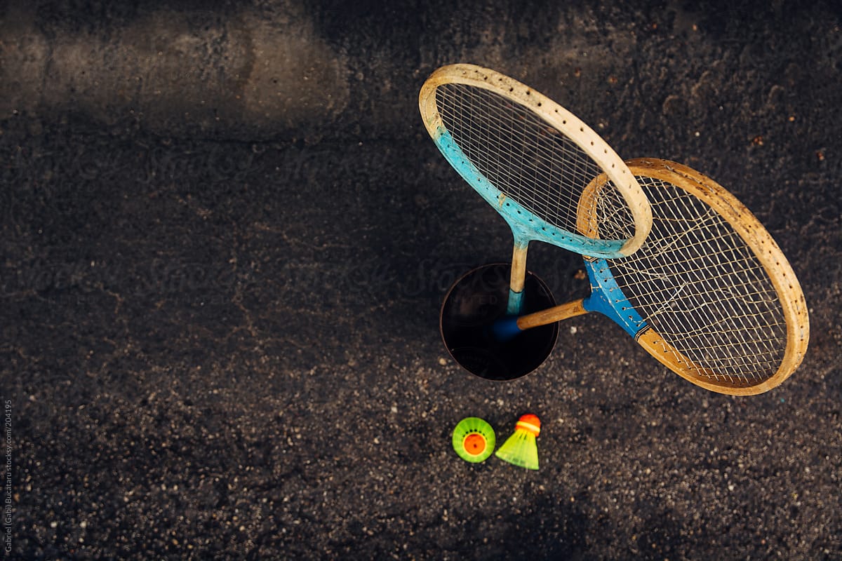 "Two Old Badminton Rackets In A Copper Can And Two Birdies From Above ...
