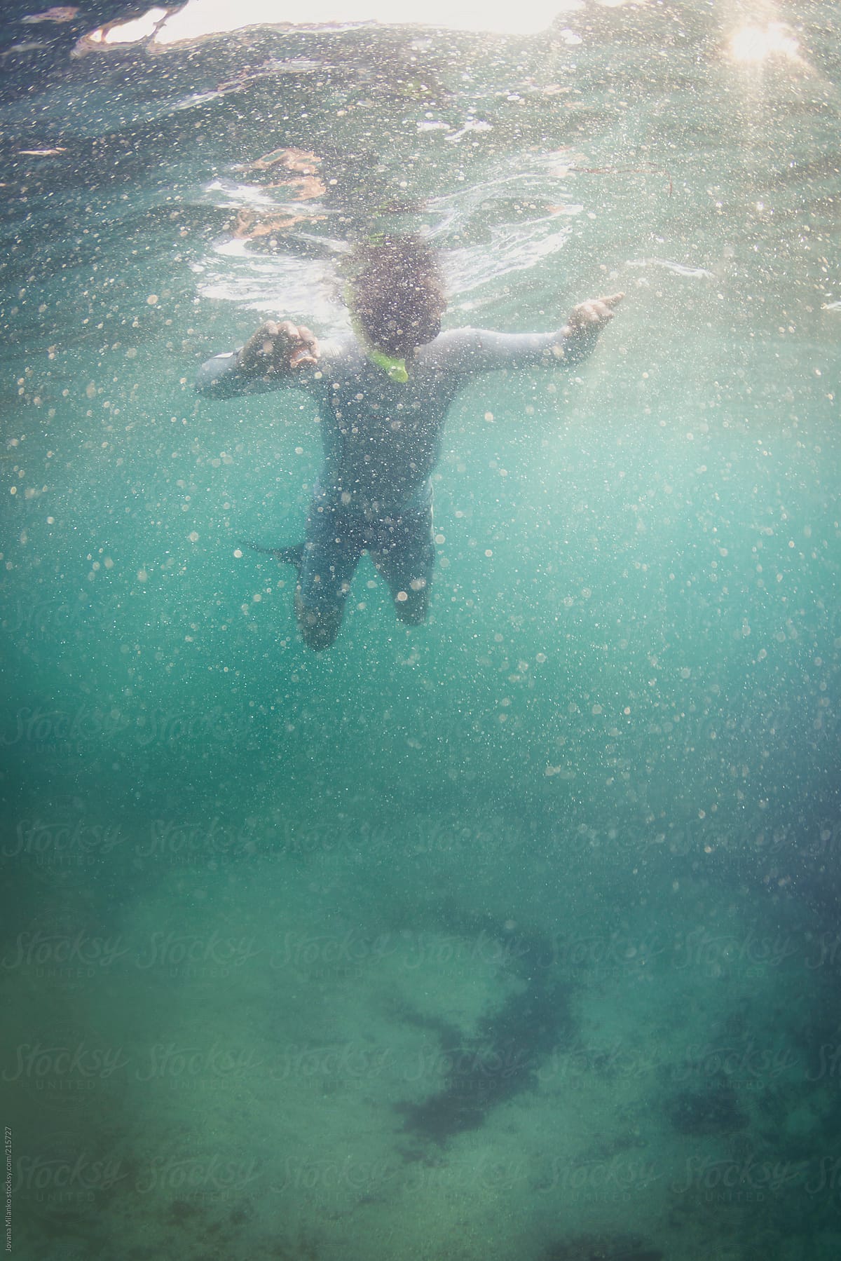 "Snorkeler Drowning In The Sea" by Stocksy Contributor "Jovana Milanko ...