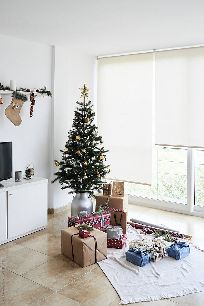 "Messy Christmas Wrapping Home." by Stocksy Contributor "Ivan Gener ...