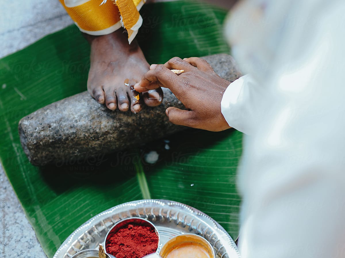 "Groom Touching The Father's Toe During Indian Ceremony" by Stocksy ...