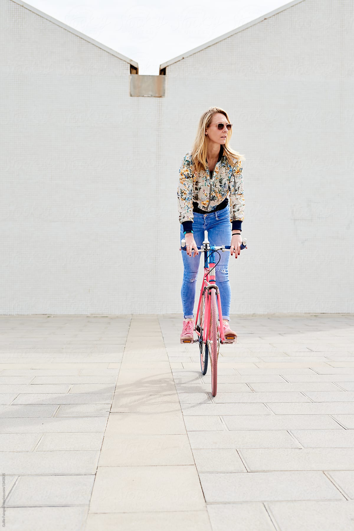 "Blonde Woman Riding Bicycle." by Stocksy Contributor "Guille Faingold ...