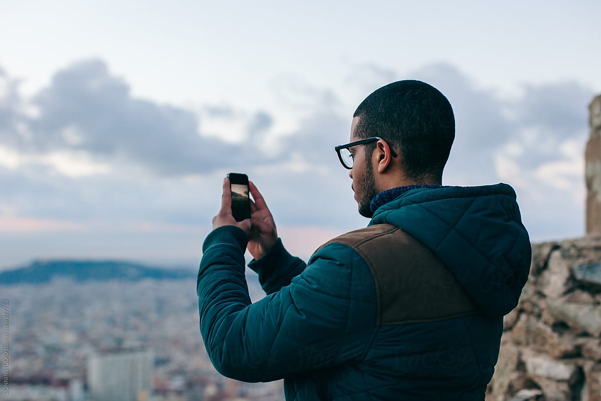 "Man Taking Photo Of Barcelona City Using His Smartphone." by Stocksy ...