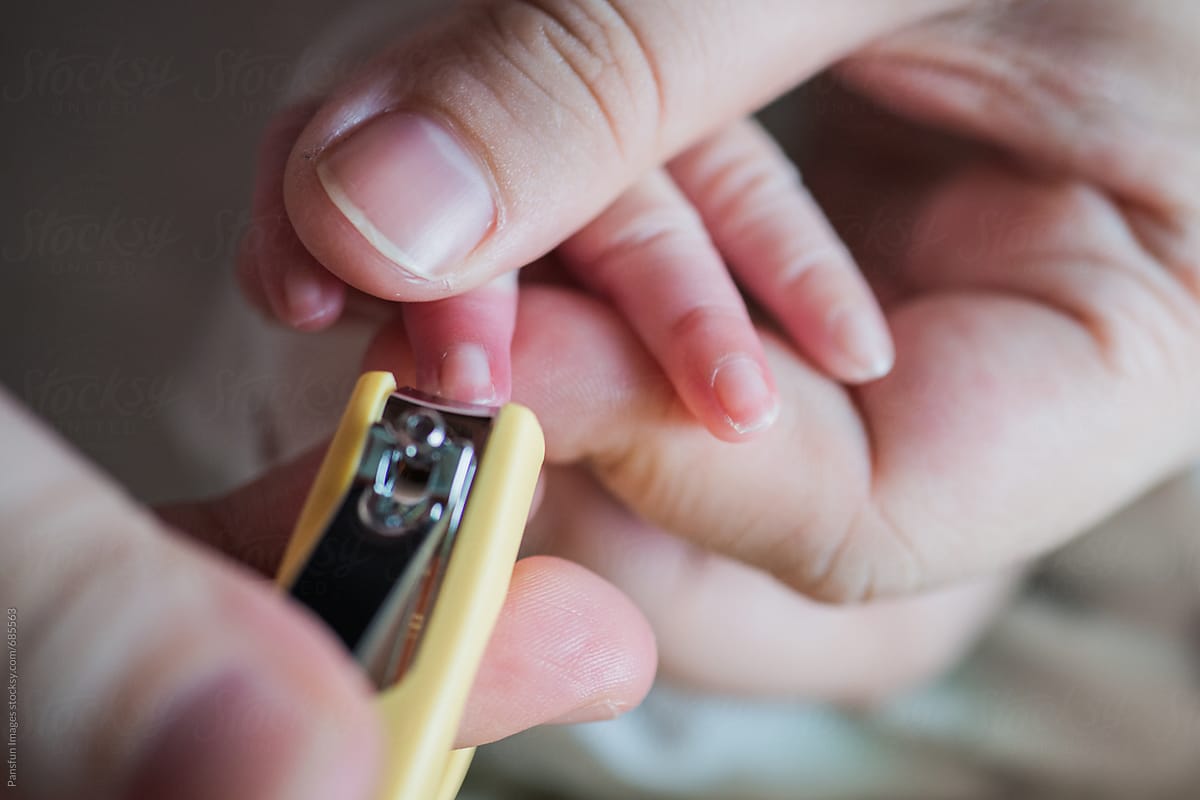 "Cut The Baby Nails" by Stocksy Contributor "Pansfun Images" - Stocksy