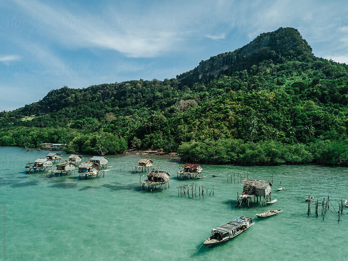 "Stilt Houses From A Nomadic Sea Tribe On An Emerald Reef In Front Of ...