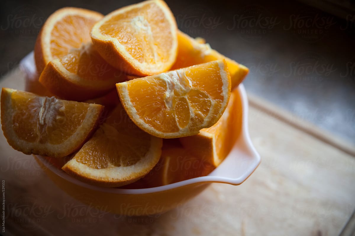 "Oranges Cut Into Quarters In Vintage Bowl" by Stocksy Contributor ...