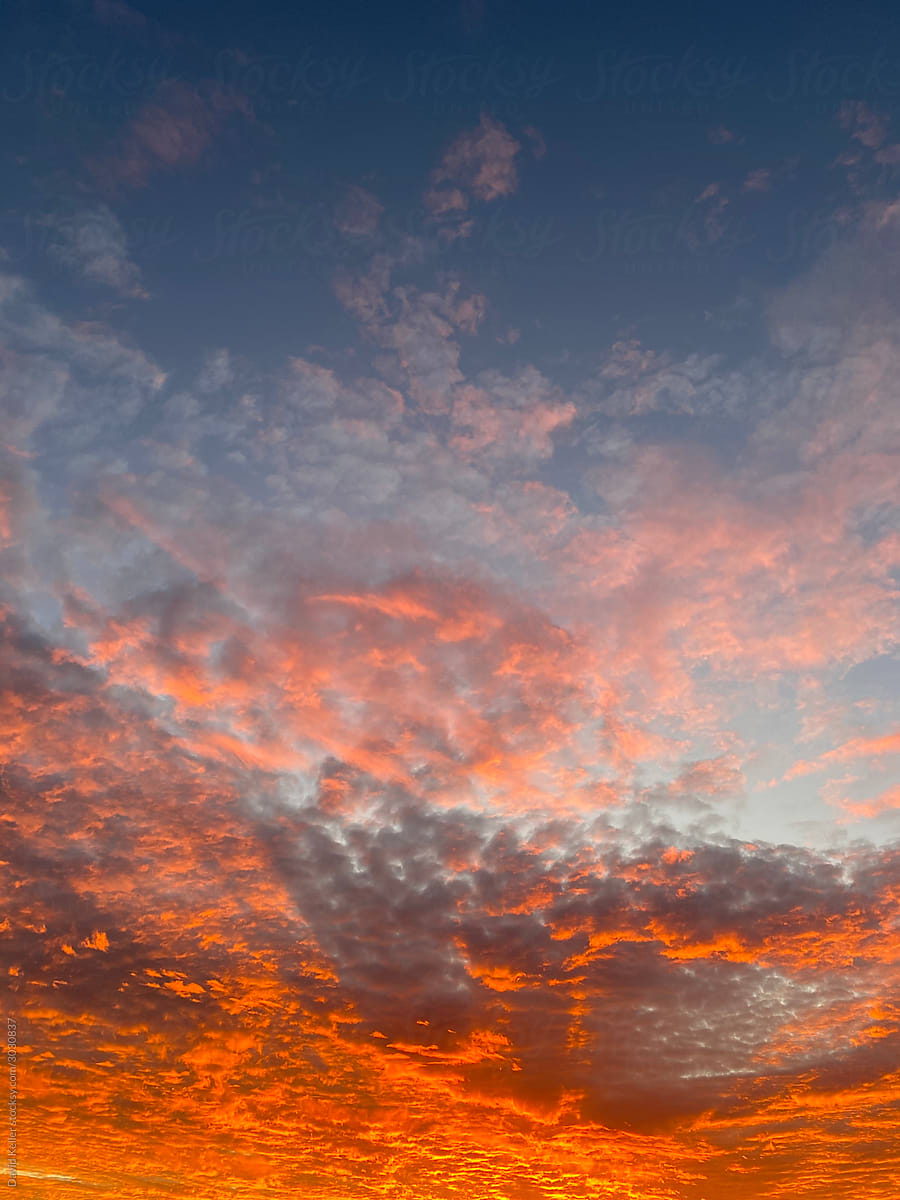 "A Red Sunset Painted On Clouds" by Stocksy Contributor "David Keller ...