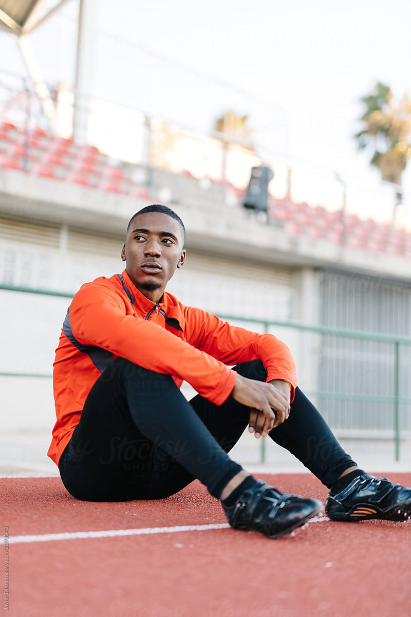 "Black Sportsman Sitting On Running Track" by Stocksy Contributor ...