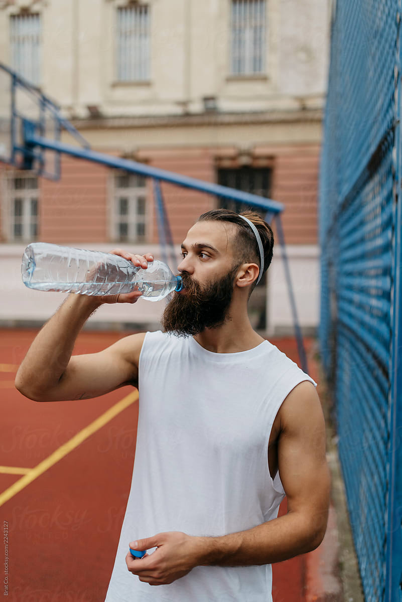 "Basketball Player Drinking Water" by Stocksy Contributor "Brat Co ...