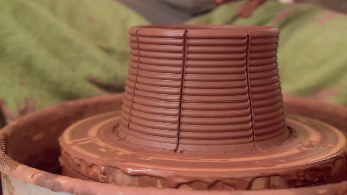 "Finishing A Clay Pot" by Stocksy Contributor "Adrian P Young" - Stocksy