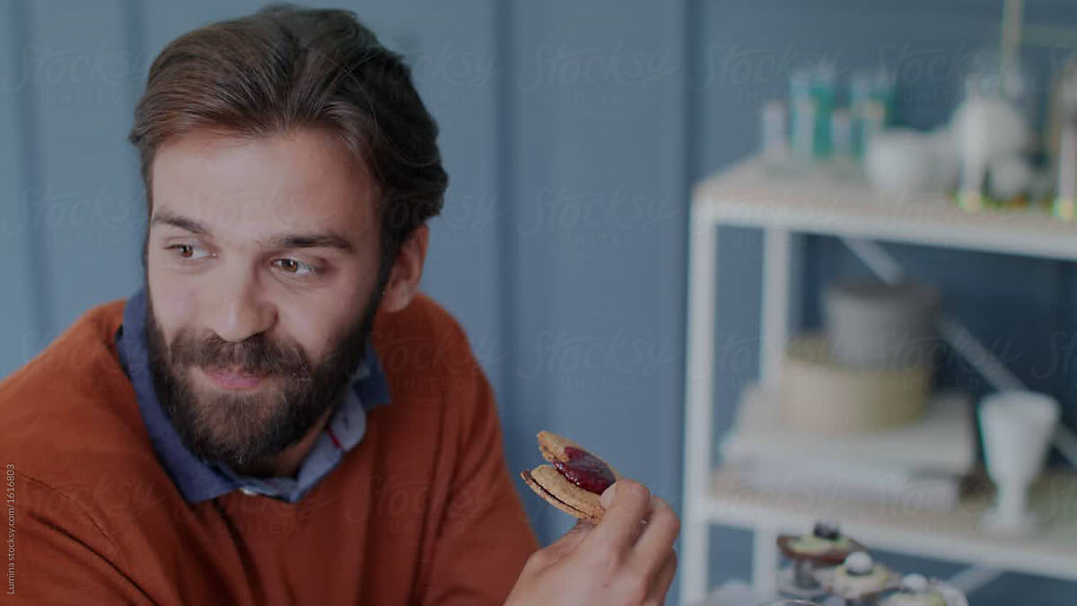 "Man Eating Dessert" by Stocksy Contributor "Lumina" - Stocksy