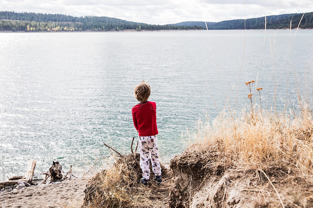 "Boy Staring Out At A Lake In His Pyjamas" by Stocksy Contributor ...