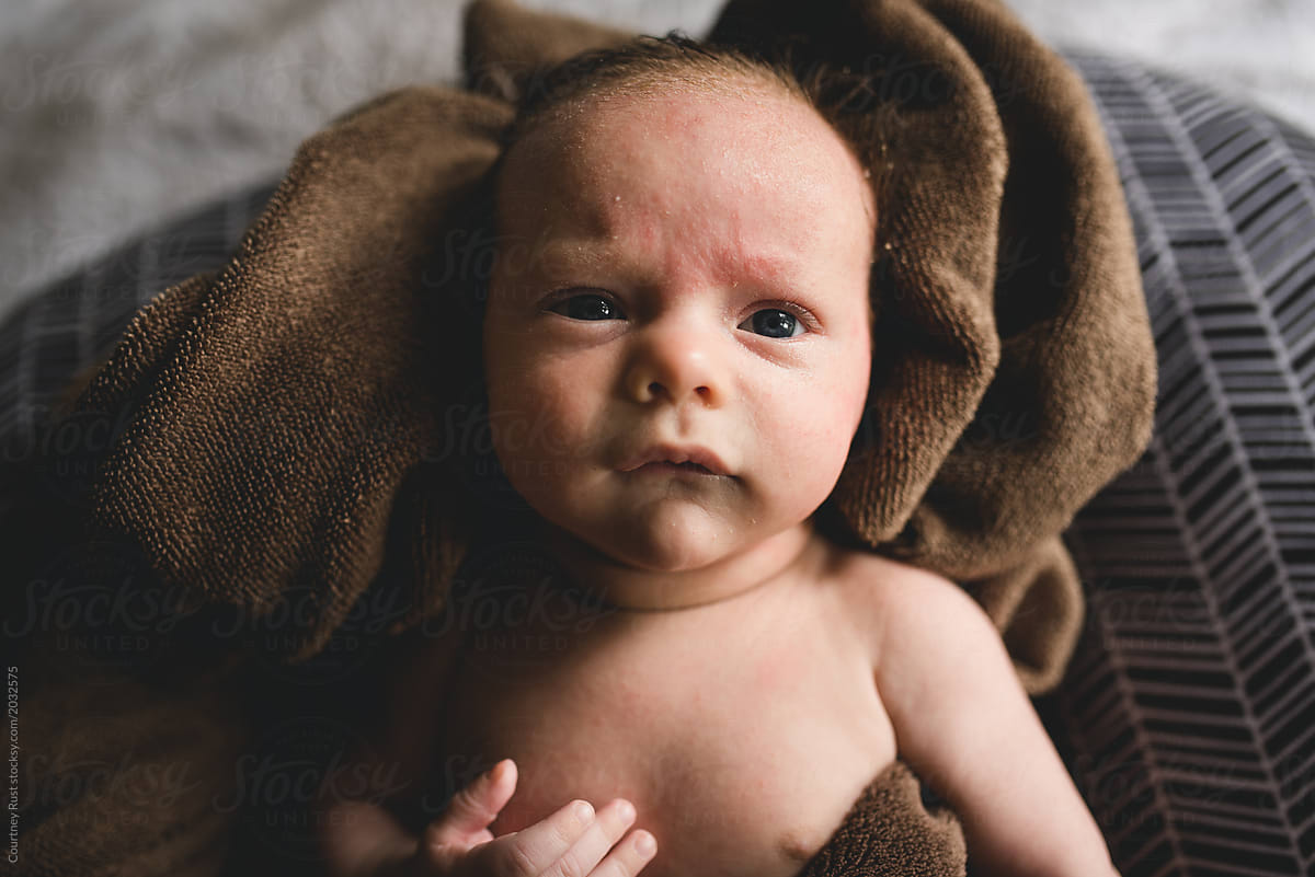 "Baby Looking Serious Before Bath Time." by Stocksy Contributor ...