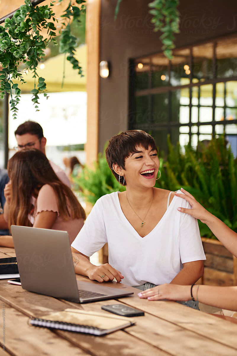 "Working From A Cafe" by Stocksy Contributor "Jose Coello" - Stocksy