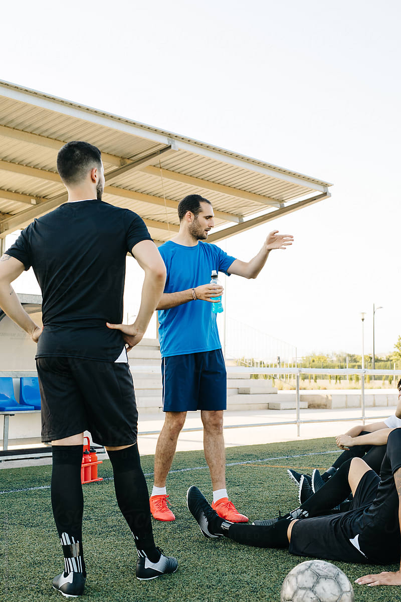 "Coach Giving Instructions" by Stocksy Contributor "Javier Díez" - Stocksy