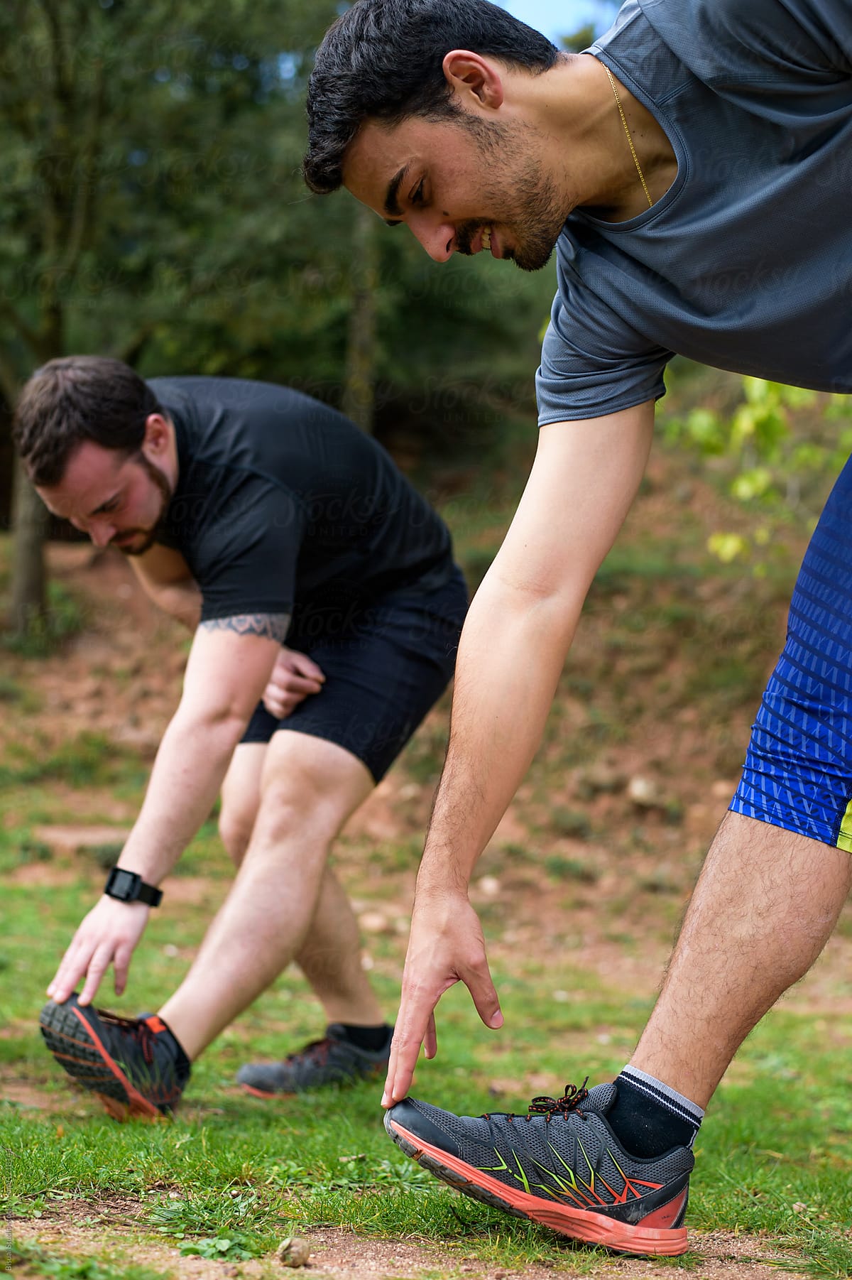 "Two Men Warming-up Exercises" by Stocksy Contributor "Bisual Studio ...