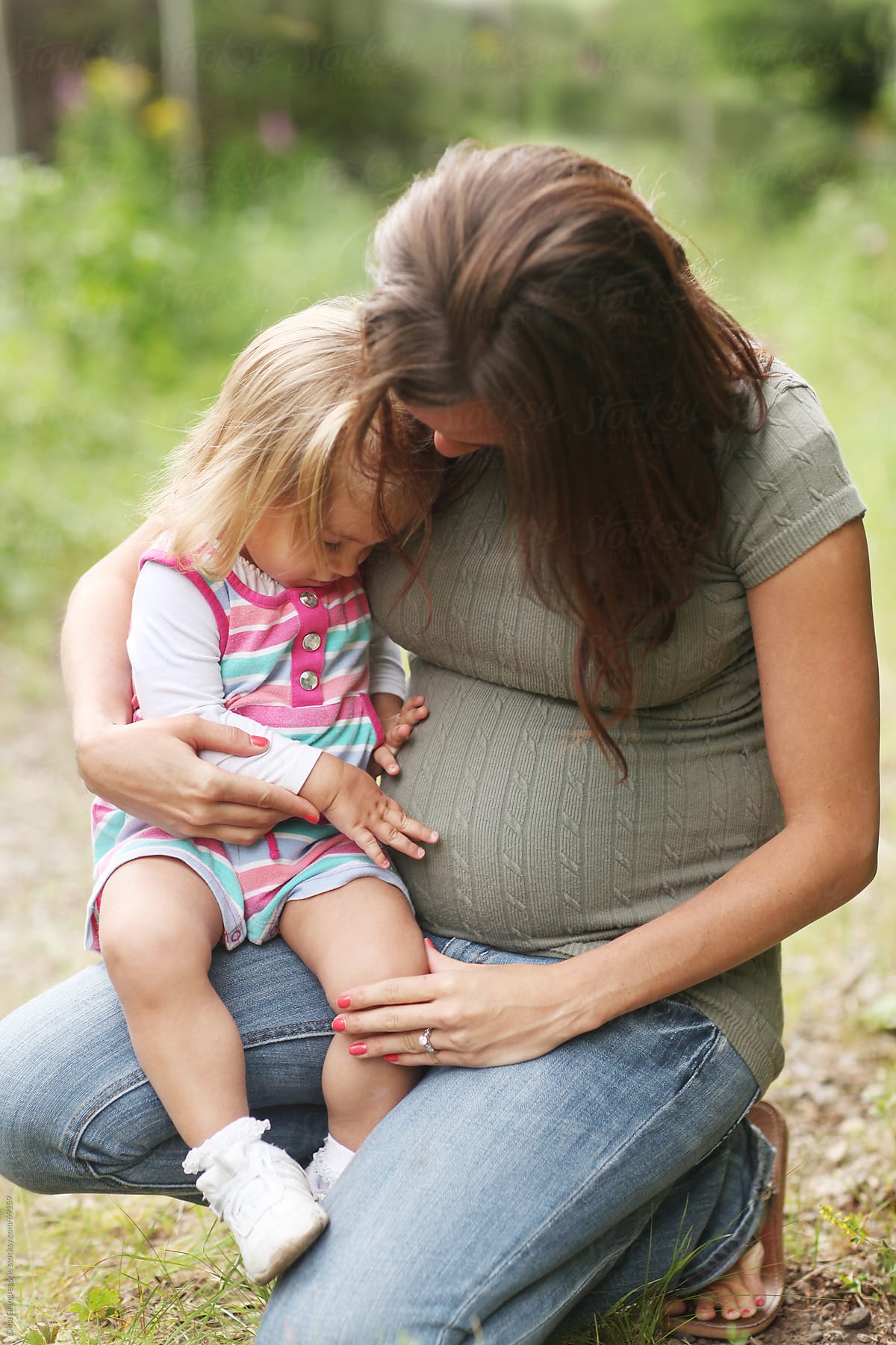 Pregnant Mother Holding Toddler By Stocksy Contributor Dina Marie Pregnant Mother Holding Toddler By Stocksy Contributor Dina Marie