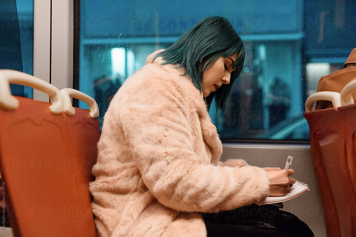 "Modern Woman Riding In Bus" by Stocksy Contributor "Milles Team" - Stocksy
