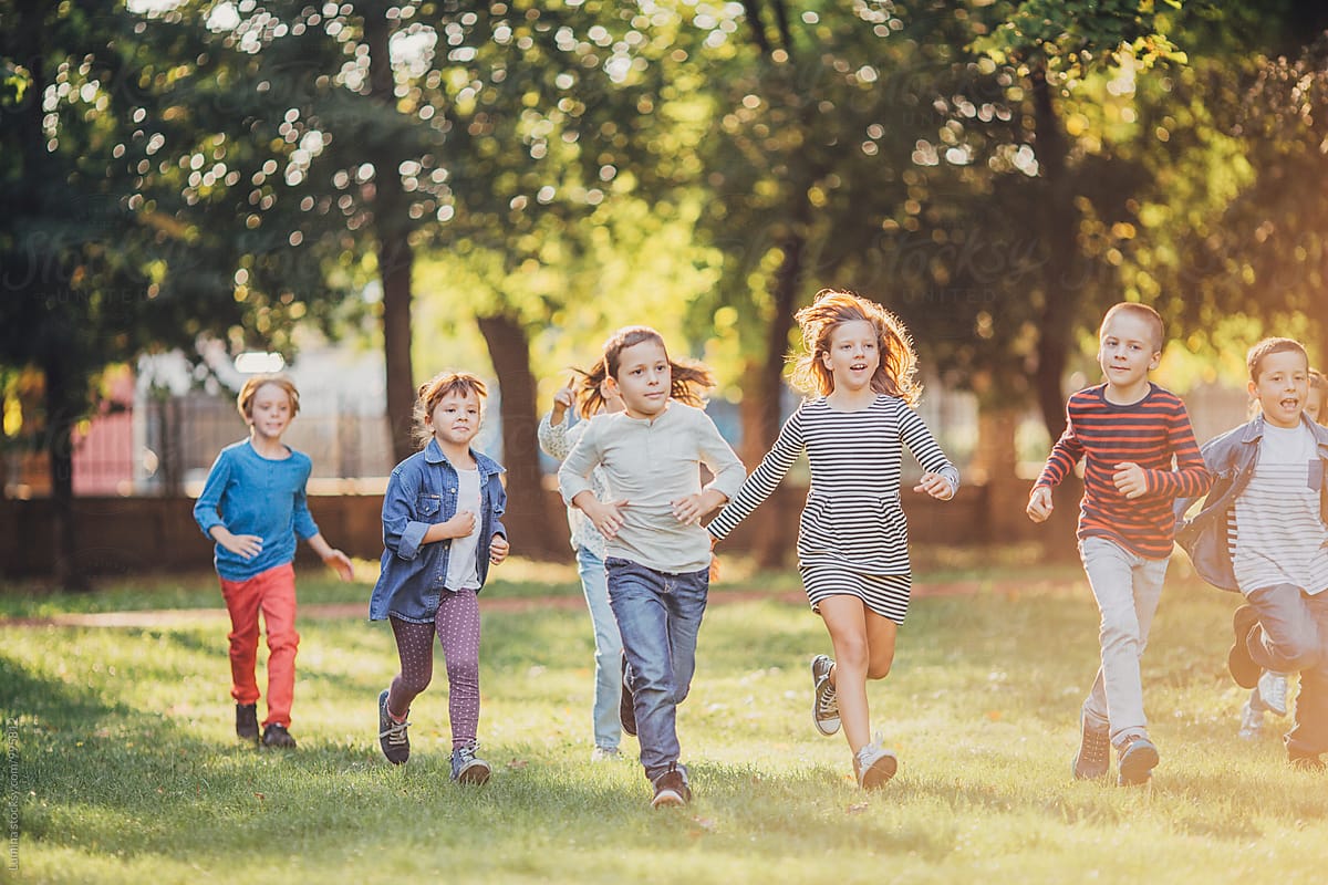 "Kids Running Outdoors" by Stocksy Contributor "Lumina" - Stocksy