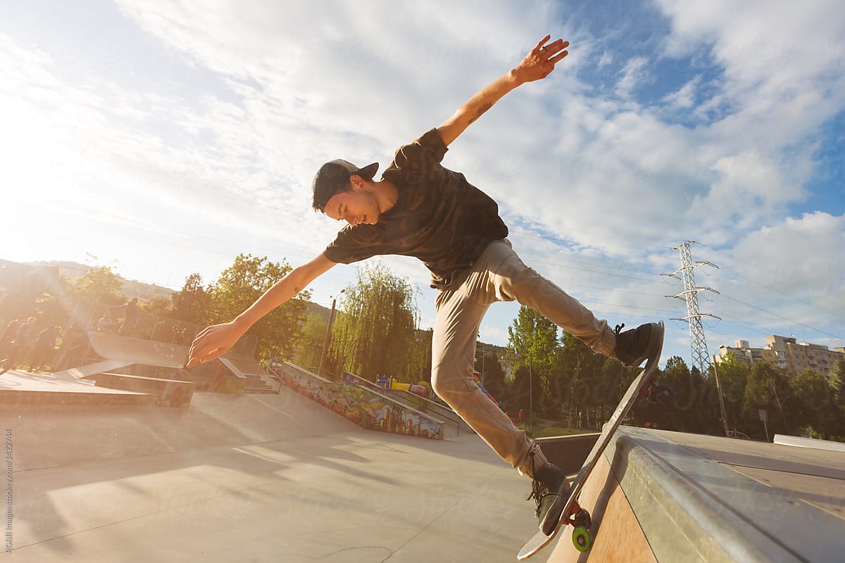 "Portrait Of Male Teenager Riding Skateboard On Wooden Ramp" by Stocksy ...