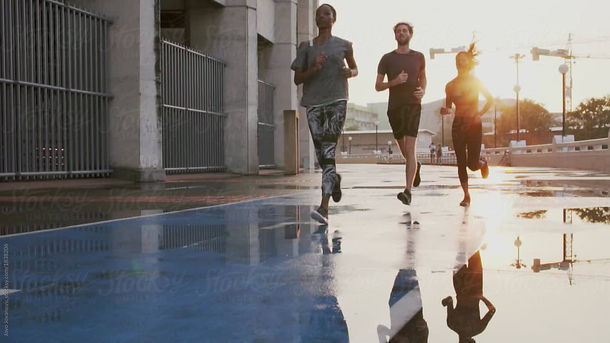"Group Of Three Friends Running Together" by Stocksy Contributor "Jovo ...