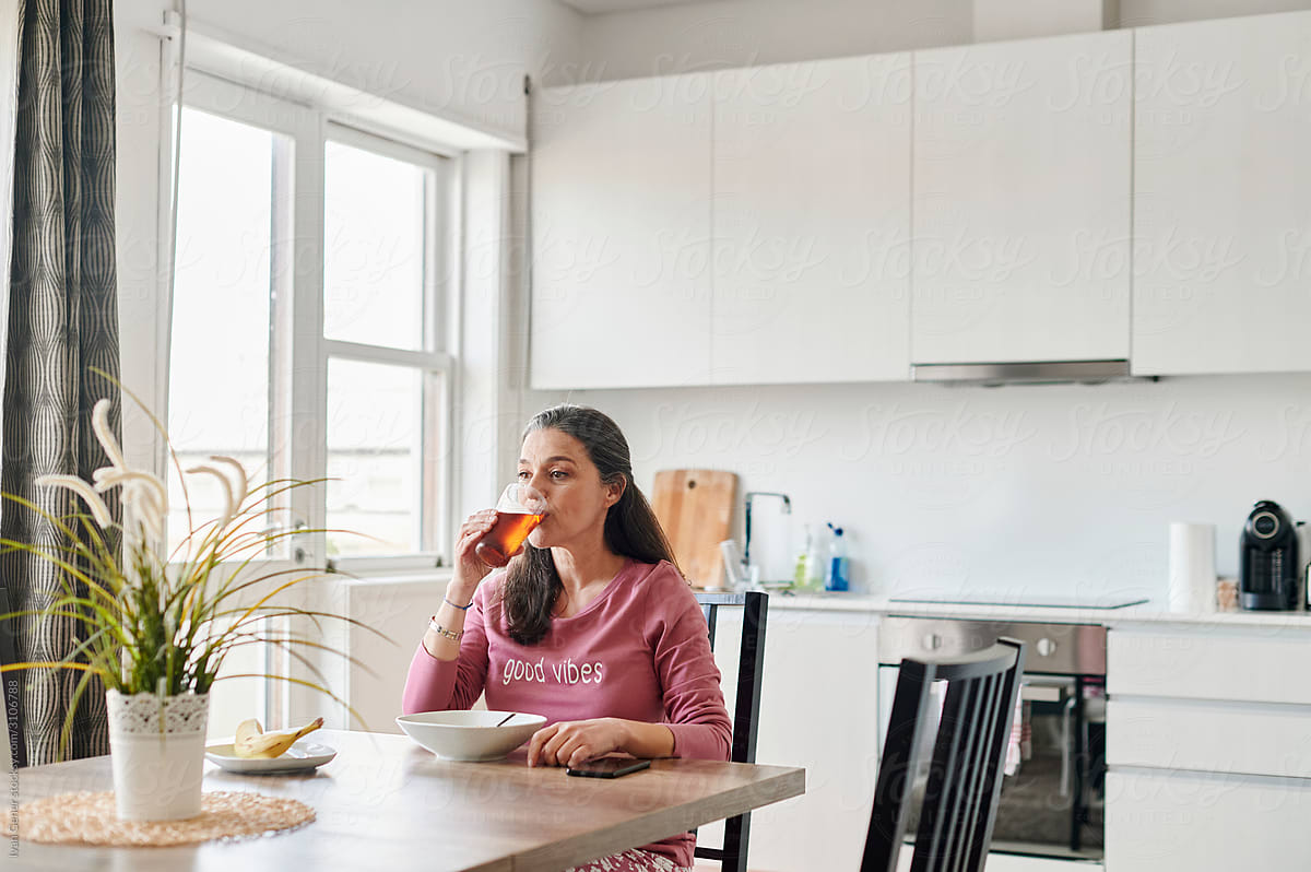 "Mature Woman Eating Breakfast At Home" by Stocksy Contributor "Ivan ...
