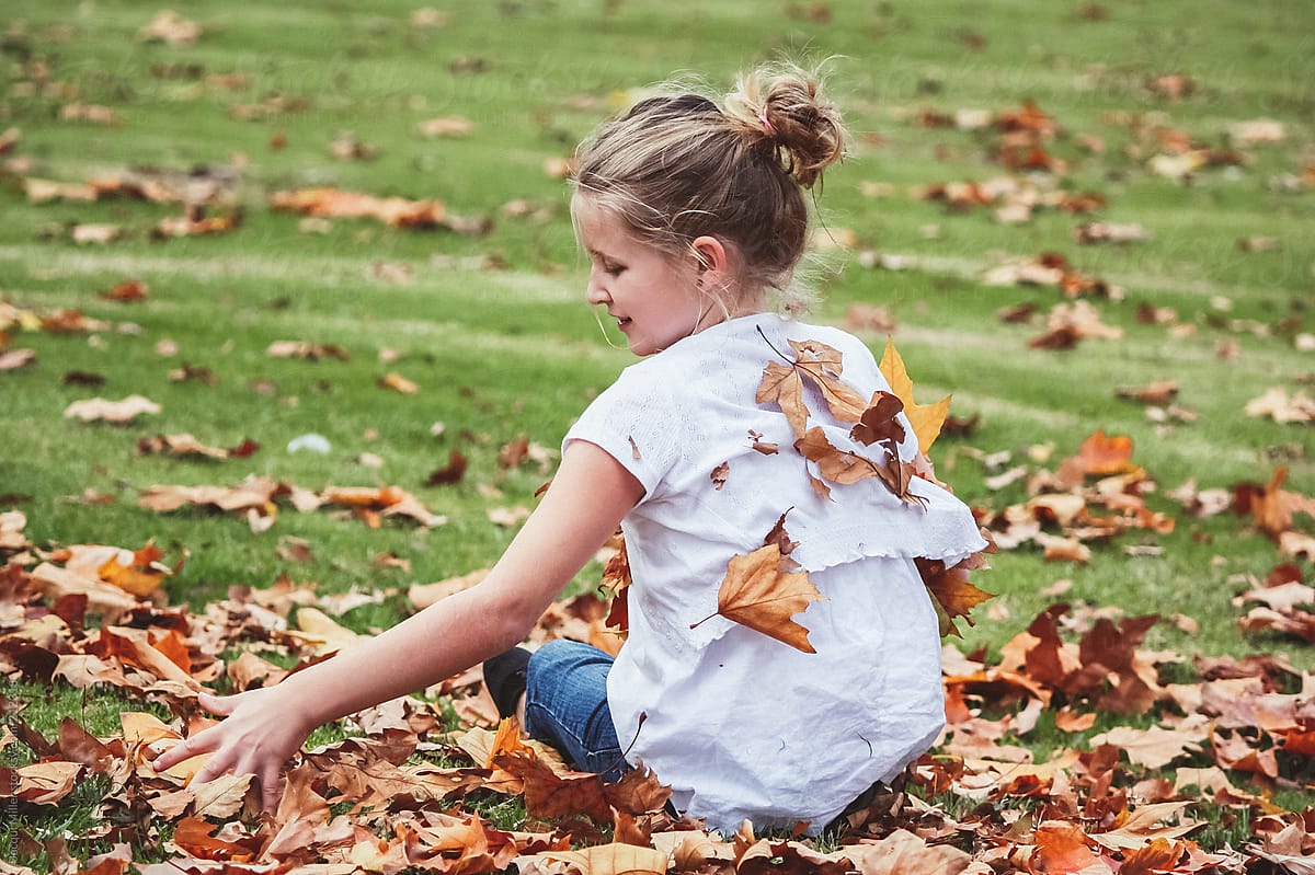 "Young Girl Collecting Autumn Leaves" by Stocksy Contributor "Jacqui ...