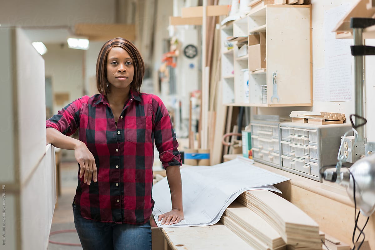 "Portrait Of A Black Female Woodworker In A Small Cabinet Shop" by ...