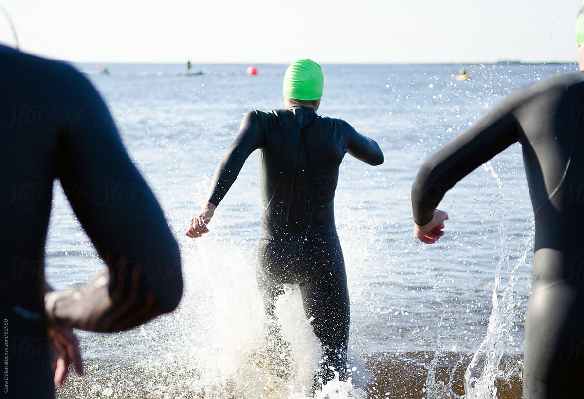 "Swimmers Take Off At The Start Of A Triathlon" by Stocksy Contributor ...