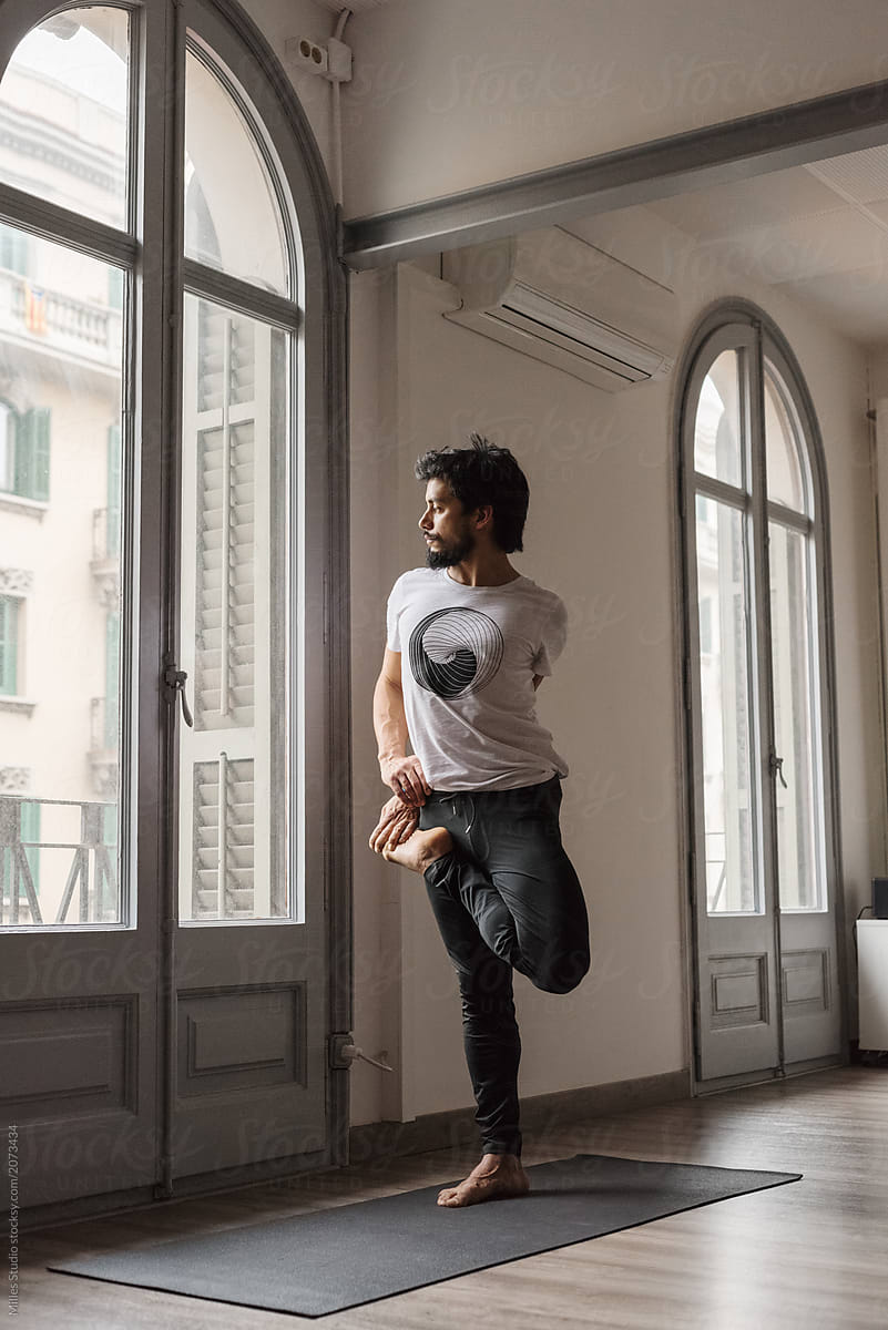 "Man Balancing And Training Yoga" by Stocksy Contributor "Milles Studio ...