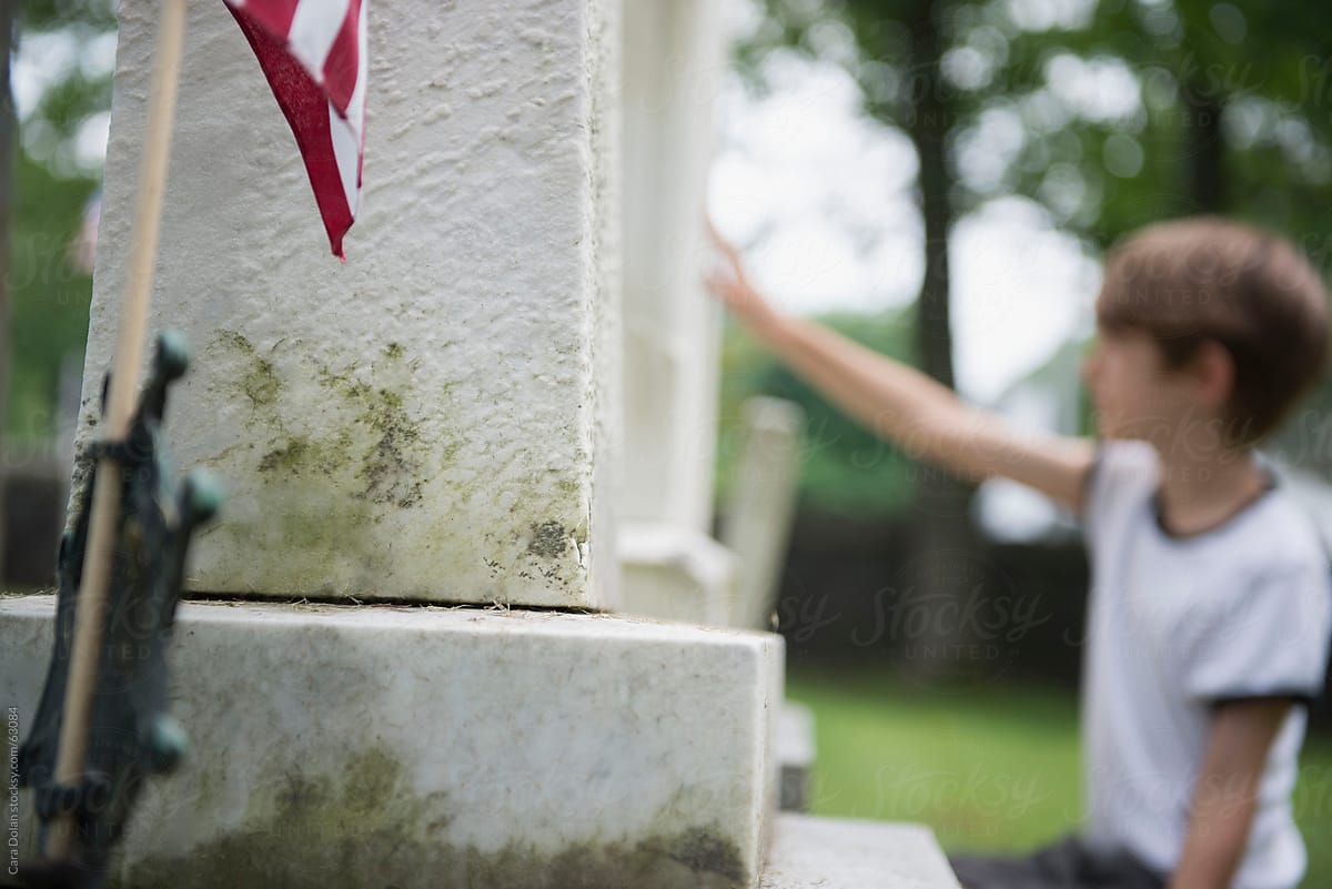 "Child Touches A Grave Marker At A Cemetery" by Stocksy Contributor ...