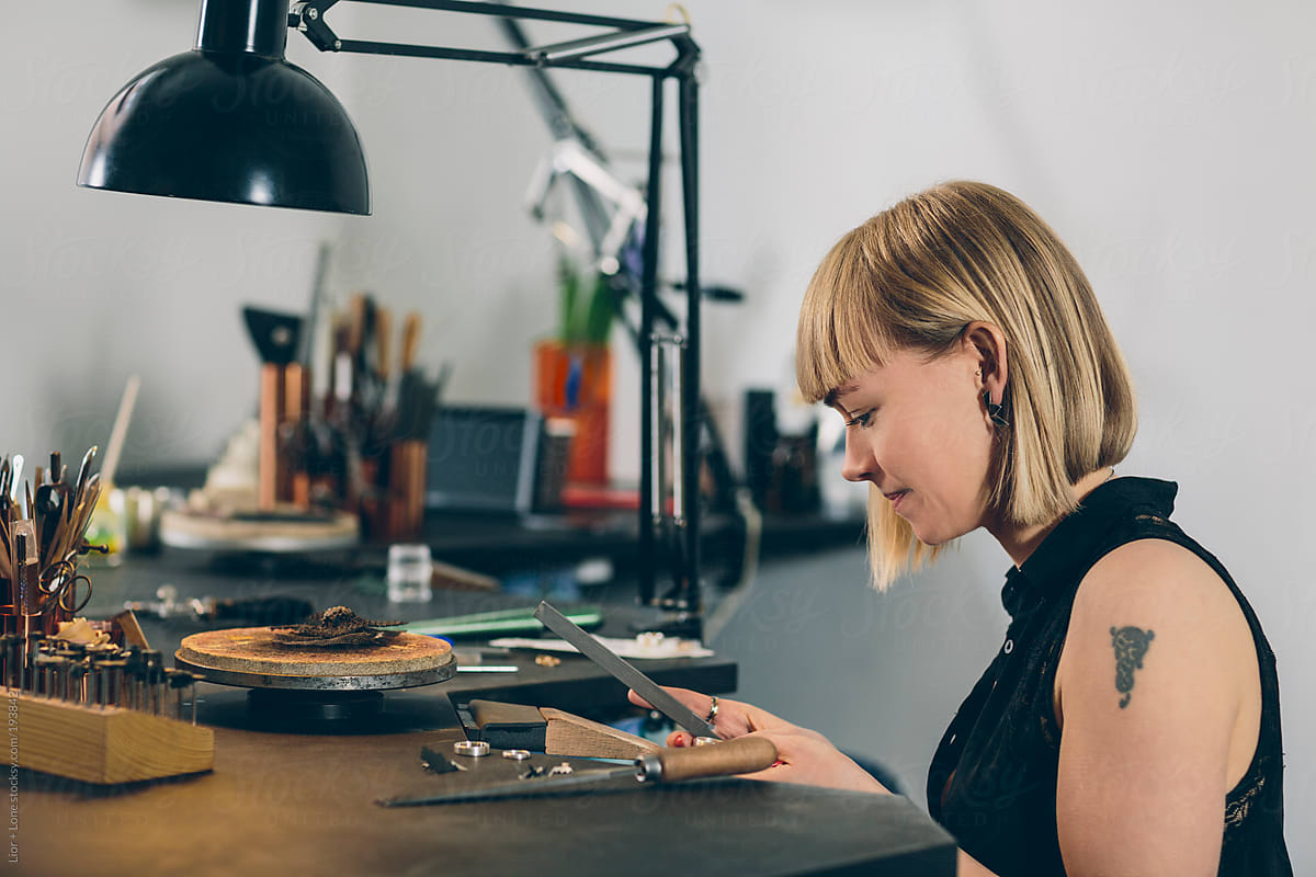 "Young Attractive Jewelry Designer Working On A Piece In Her Workshop ...