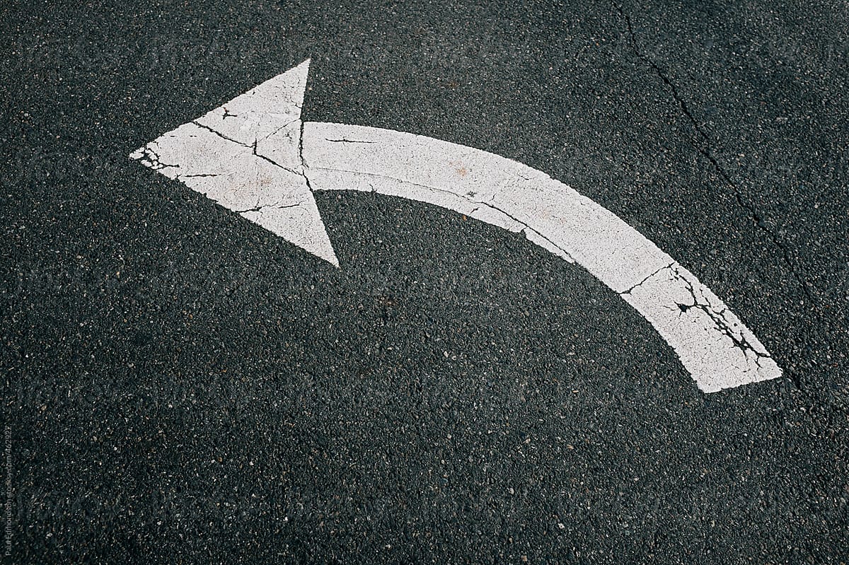"Painted Arrow On Street" by Stocksy Contributor "Rialto Images" - Stocksy