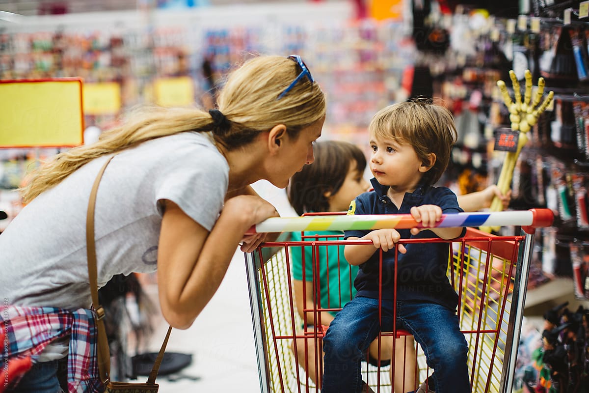 "Mother With Her Kids Shopping" by Stocksy Contributor "Nasos Zovoilis ...