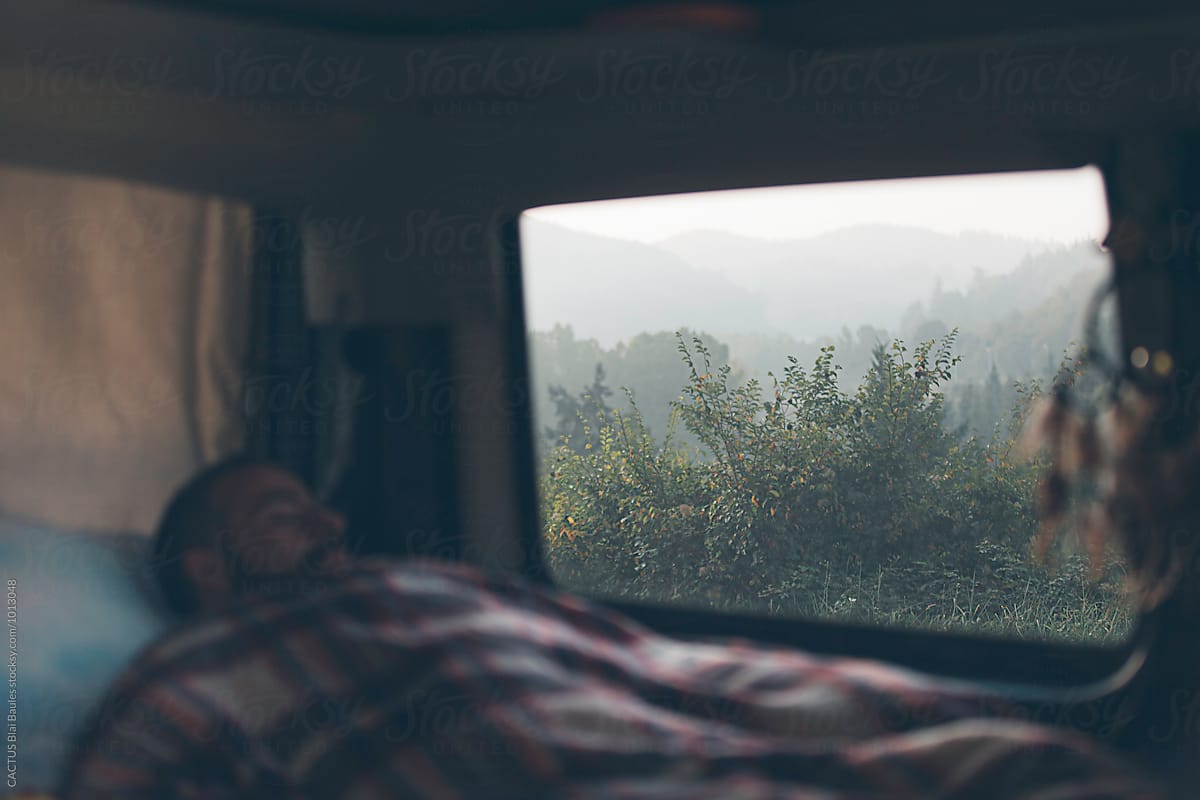 "Sleeping In A Camper Van, Mountain Views From The Window" by Stocksy ...