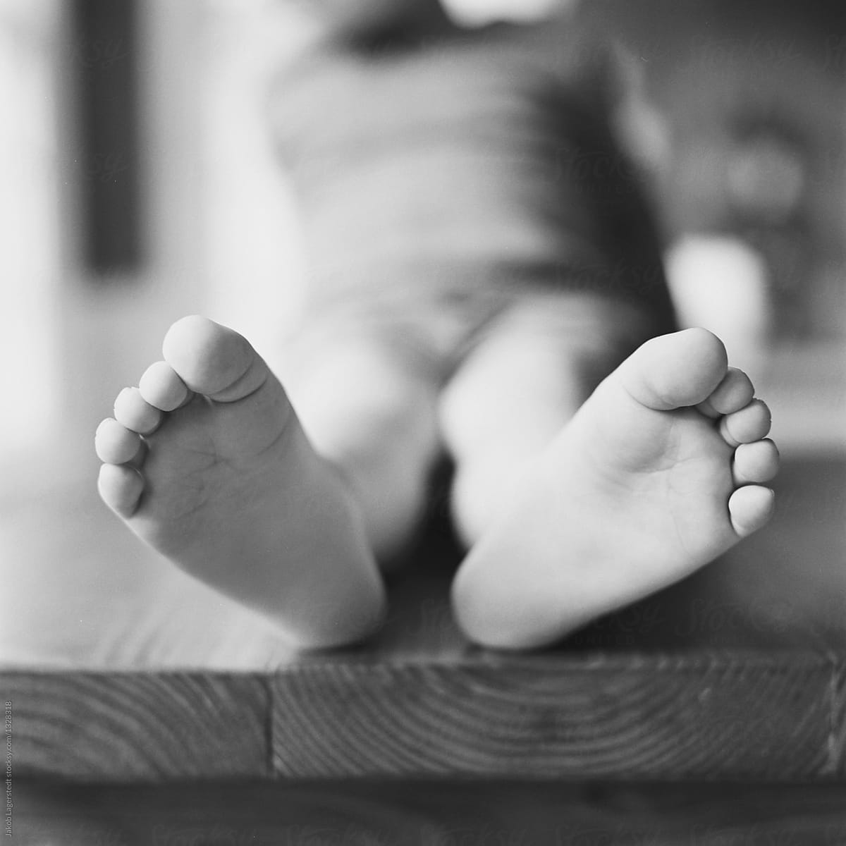  Black And White Close Up Of A Pair Of Young Baby Feet By Stocksy
