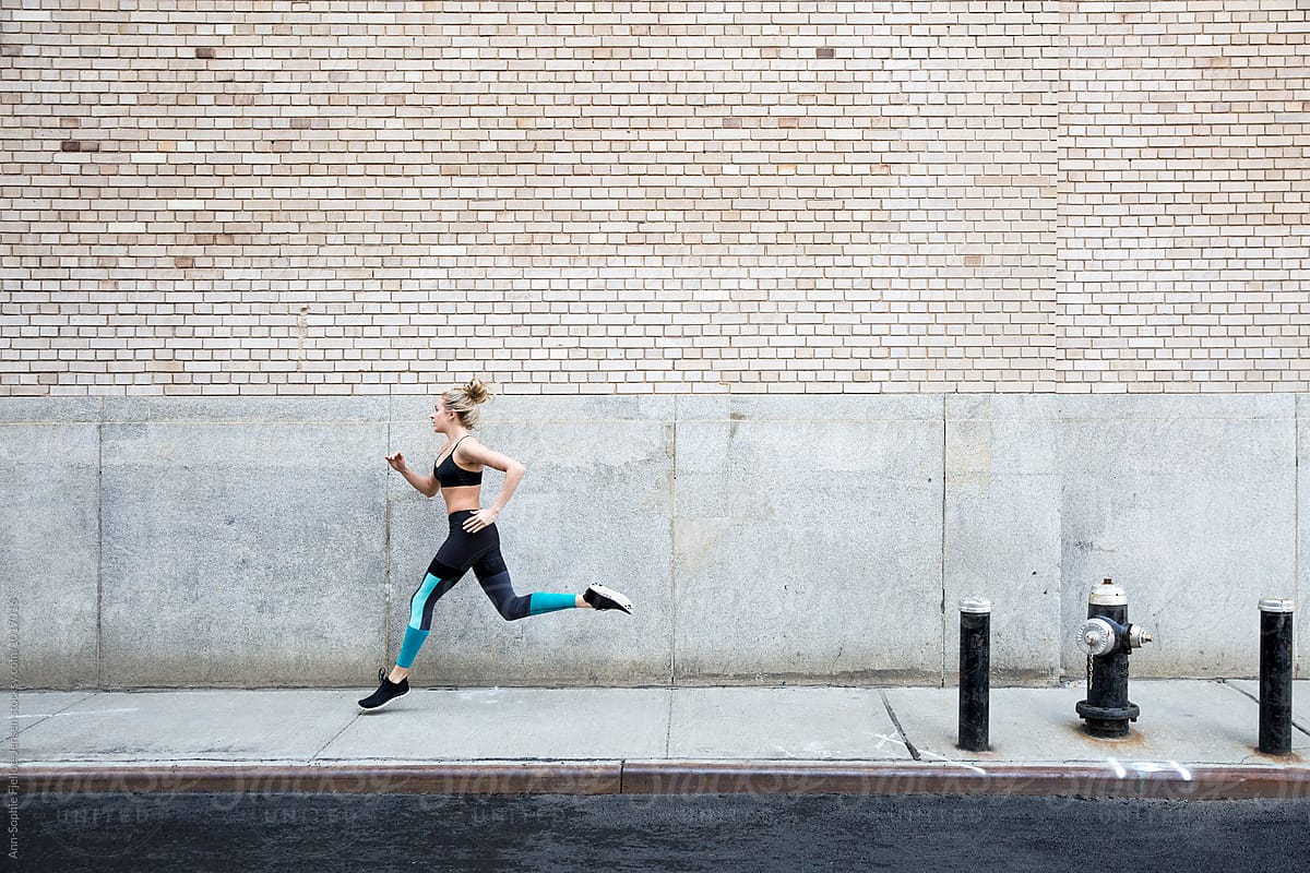 "Woman Running Through A City" by Stocksy Contributor "Bowery Image ...