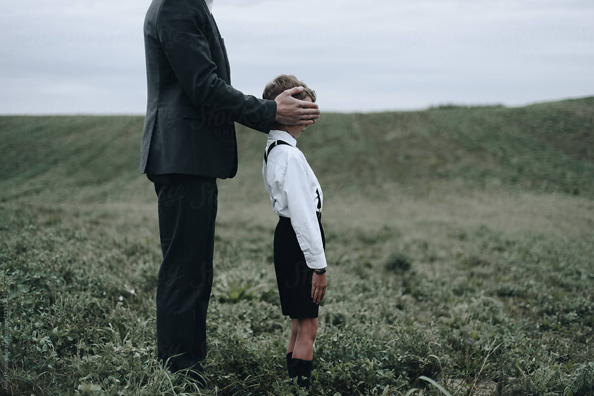 "Man And Boy Playing In Field" by Stocksy Contributor "Alina Hvostikova ...