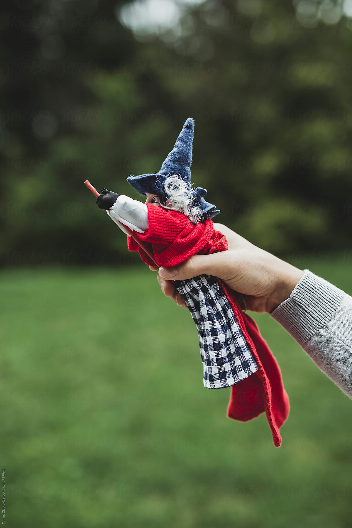 "Hand Holding Witch Toy" by Stocksy Contributor "Tatjana Zlatkovic ...