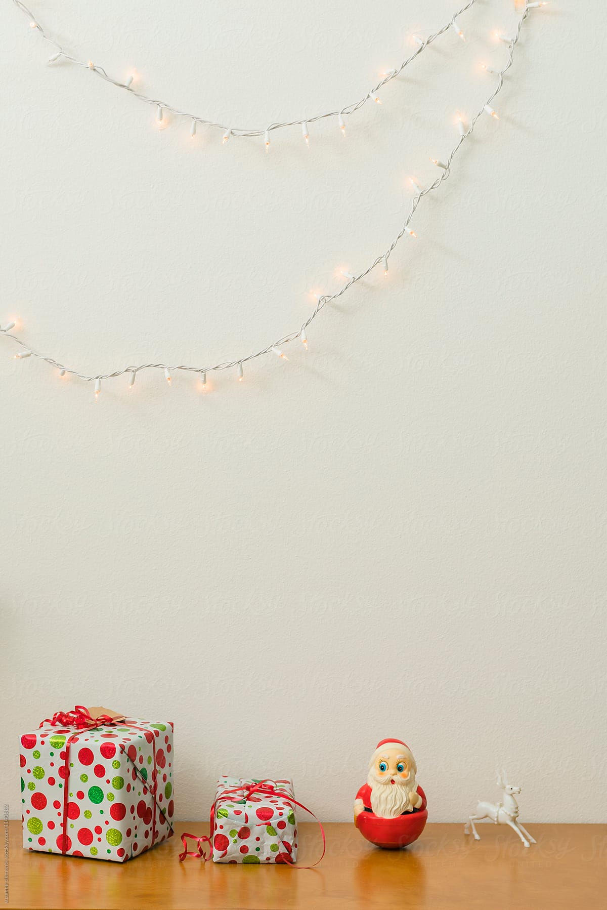 "Gifts And Santa Toy Out Of Christmas Decorations" by Stocksy ...